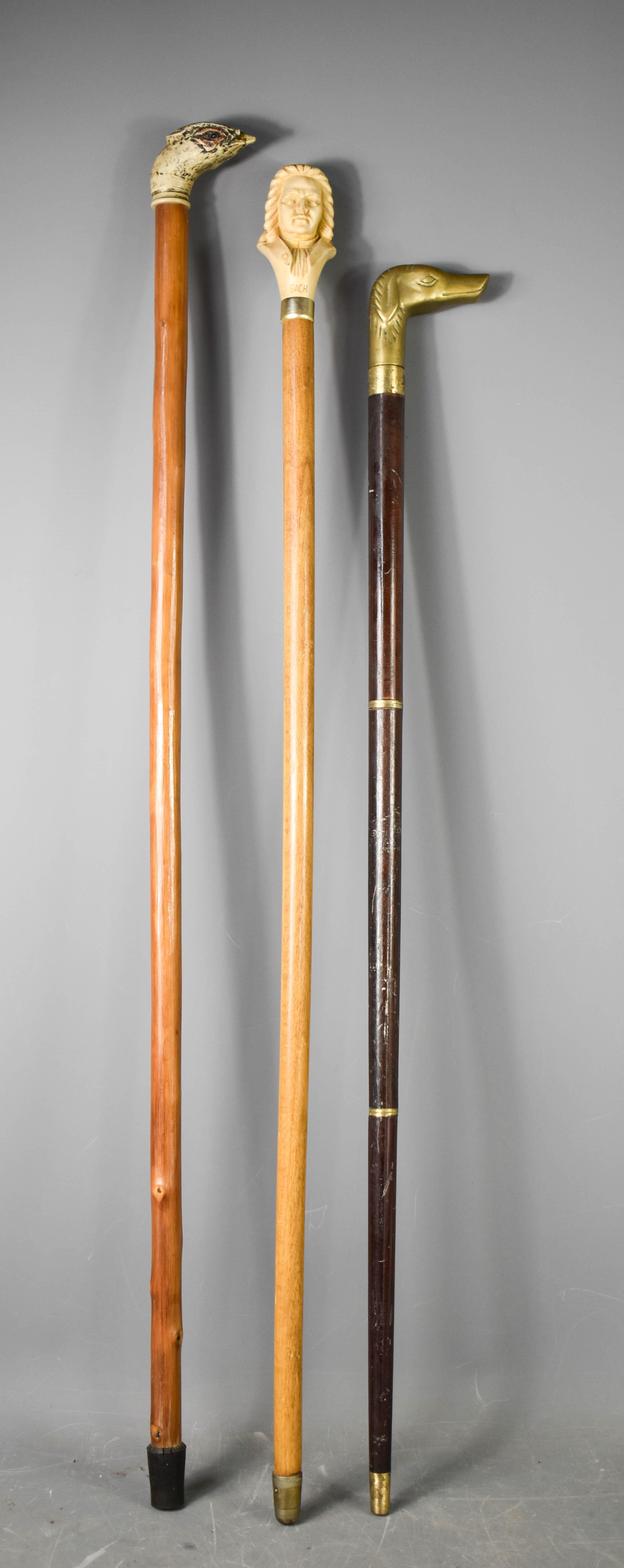 Lot 209 - Three vintage walking canes, one having a