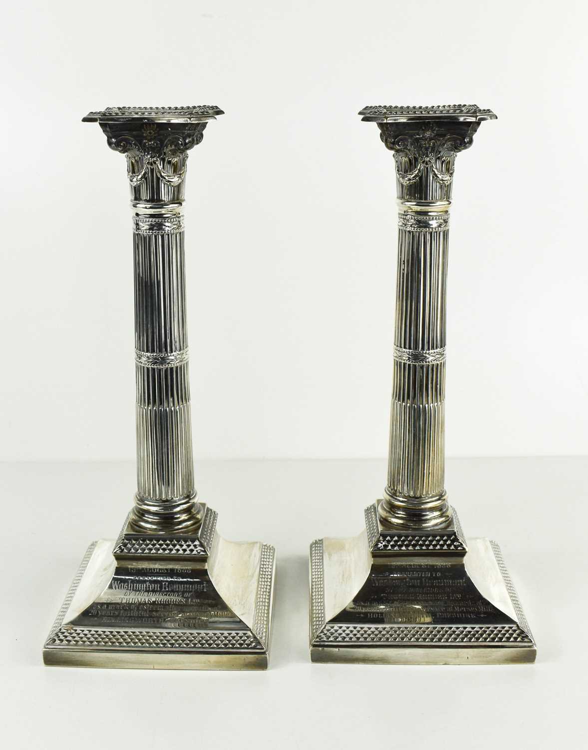 Lot 411 - A pair of silver column form candlesticks,