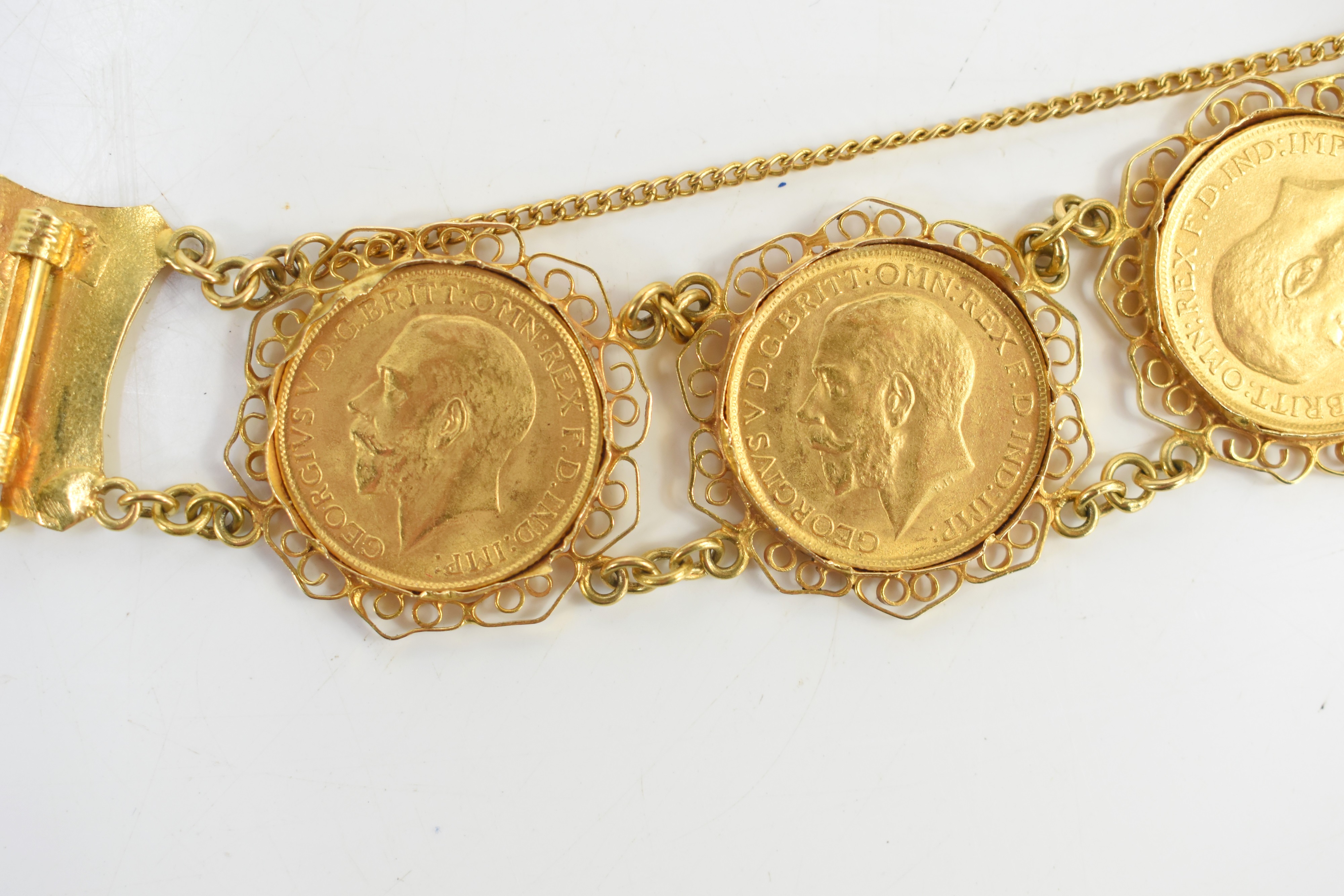 Lot 49 - An 18ct gold sovereign bracelet set with five