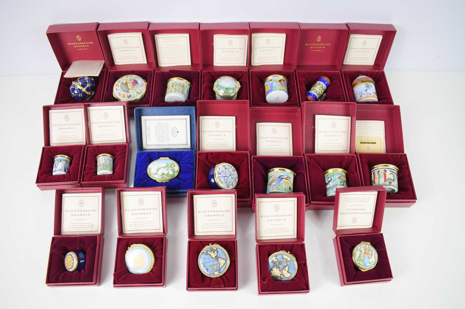 Lot 334 - Nineteen handpainted enamel boxes comprising