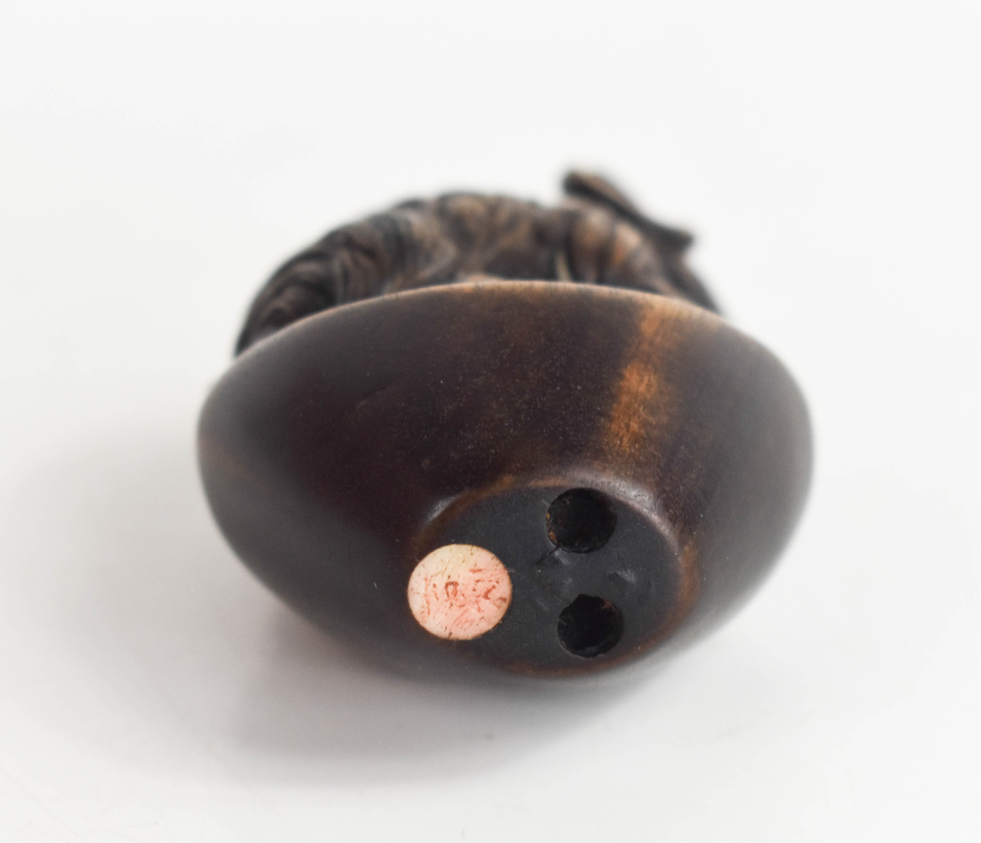 Lot 157 - A Japanese carved wooden netsuke of a ram,