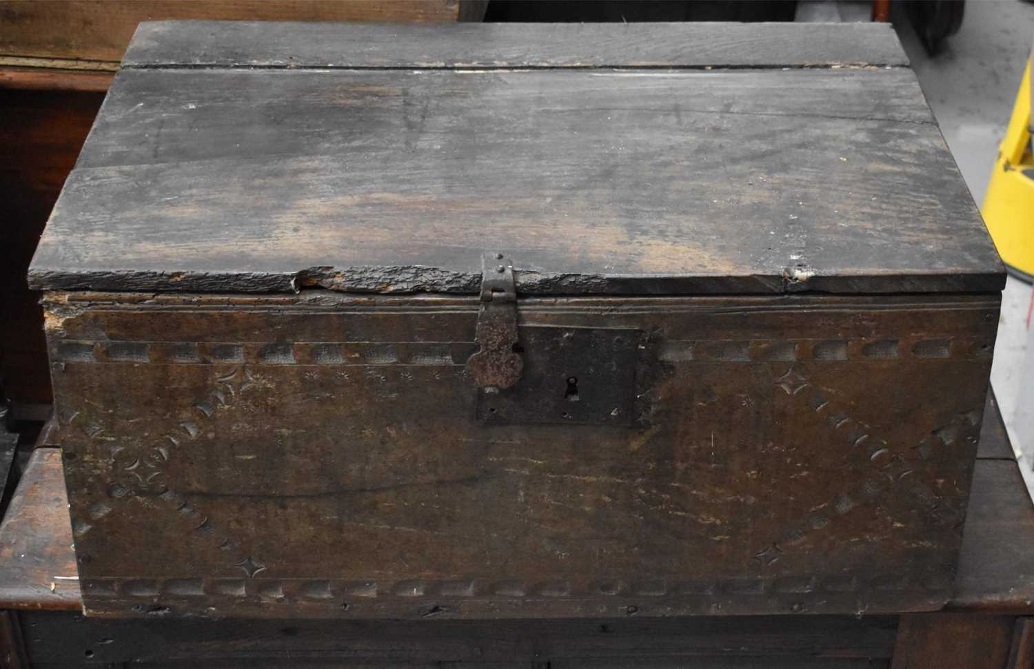 Lot 523 - An 18th century oak chest with iron lock