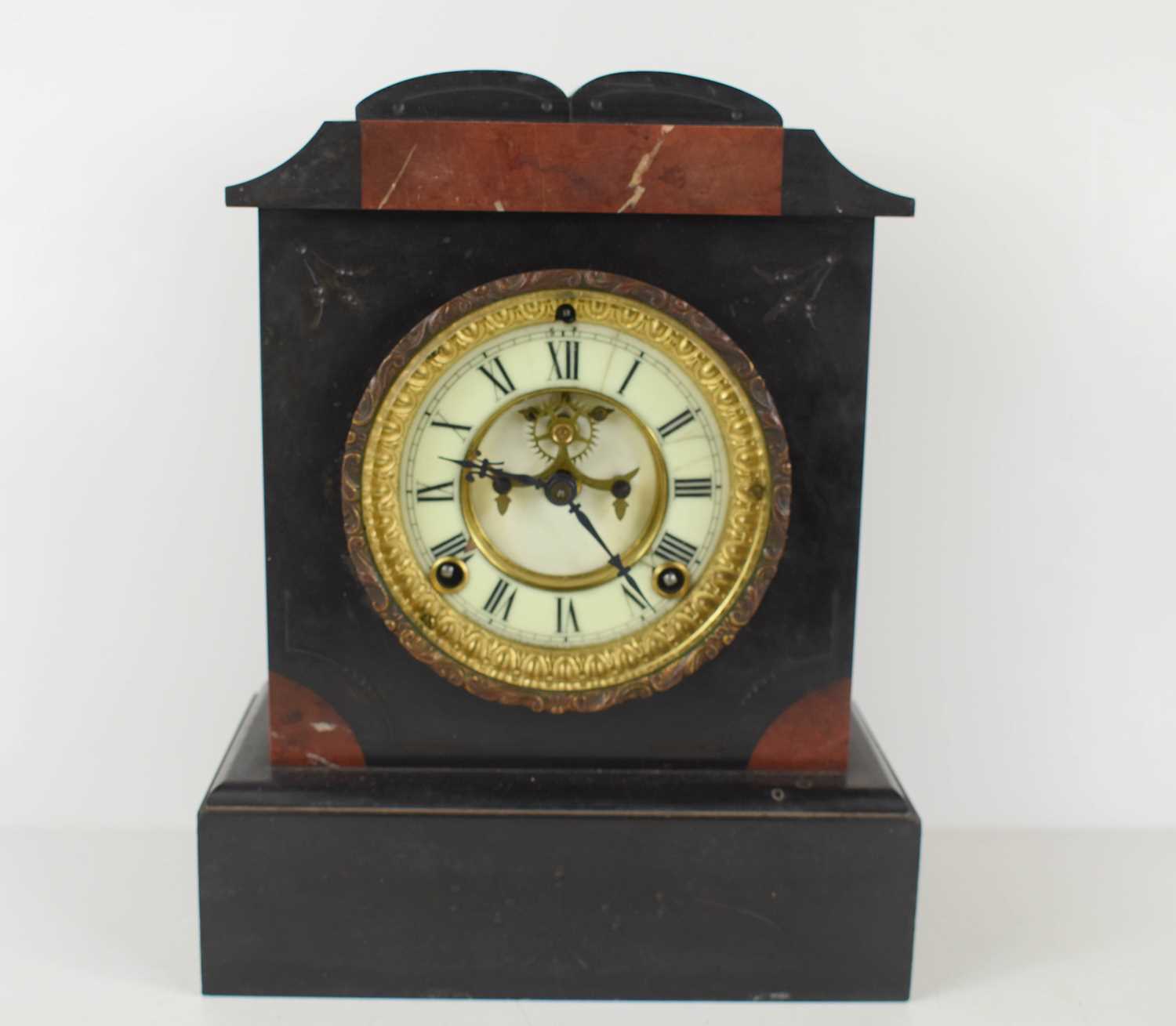 Lot 275 - A Victorian slate mantle clock having an