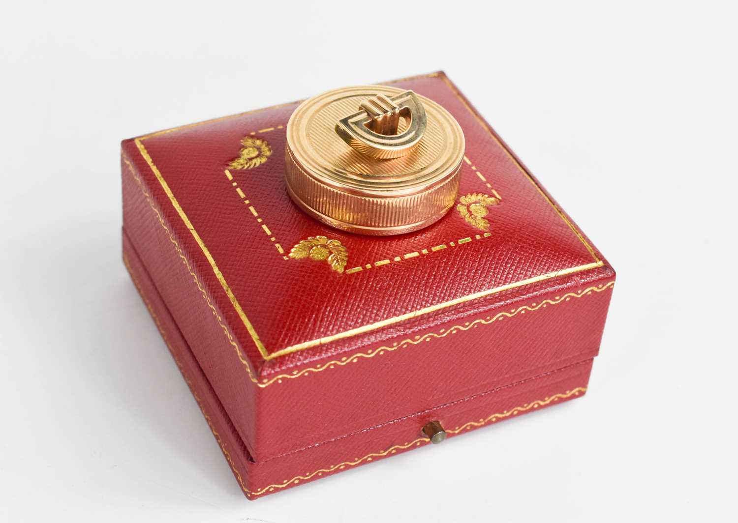 Lot 42 - A 9ct gold Cartier pill box, Art Deco period,
