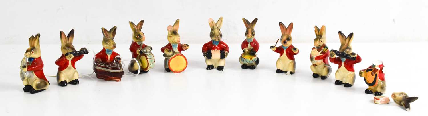 Lot 194 - A group of eleven rabbit figures playing