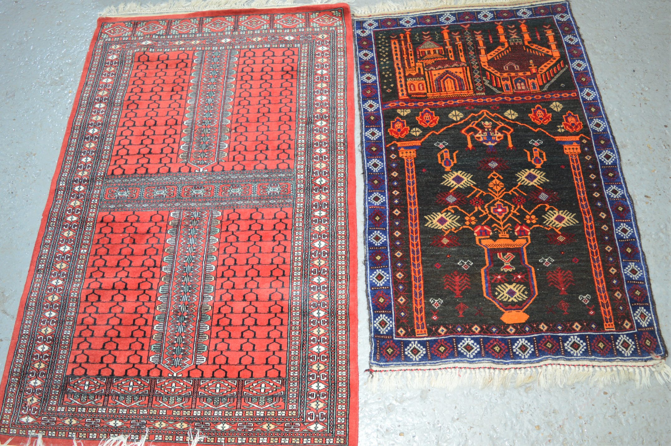 Lot 484 - A Middle Eastern prayer mat depicting