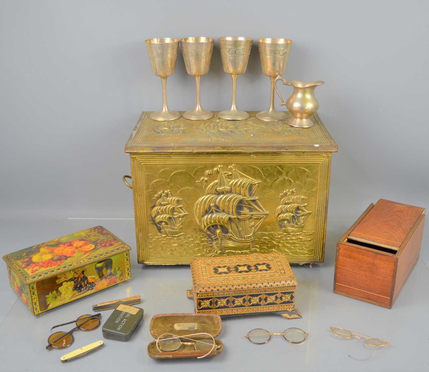 Lot 227 - A brass clad box with embossed decoration