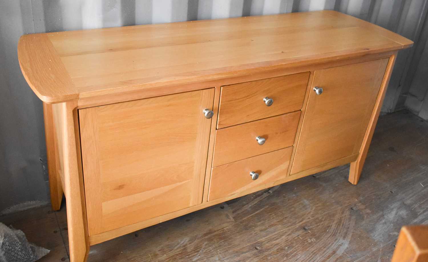 Lot 237 - A modern beech sideboard with three short