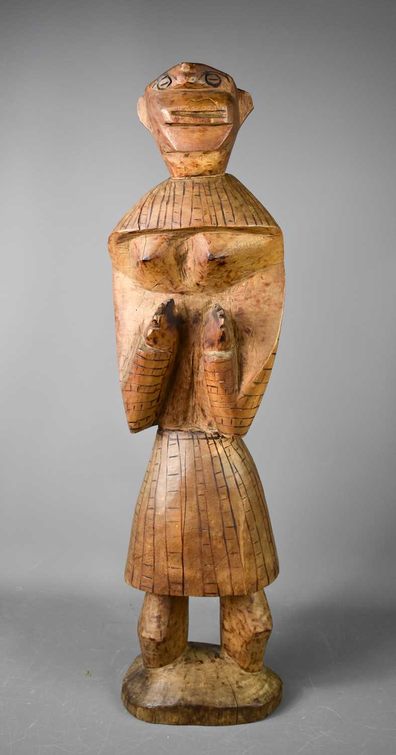 Lot 240 - A large carved African figure of a woman,